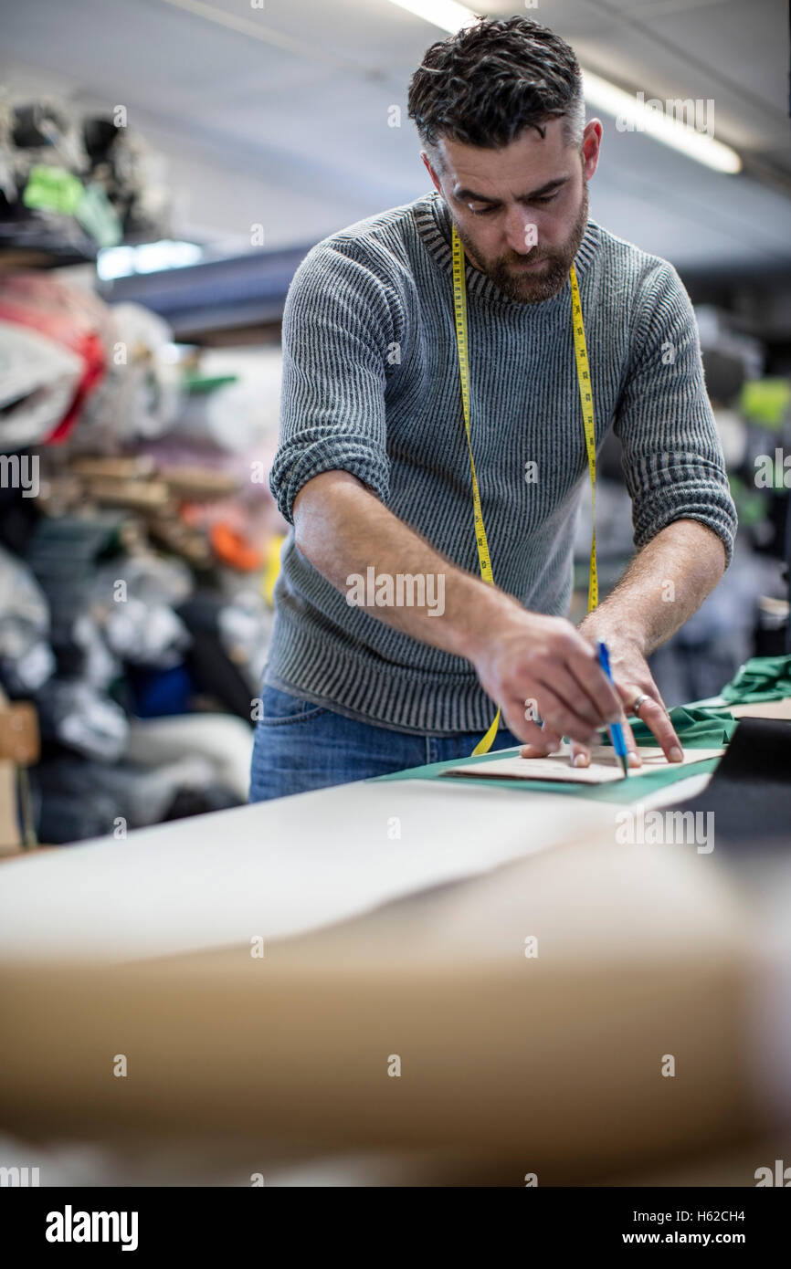 Tailor at work in workshop Stock Photo - Alamy