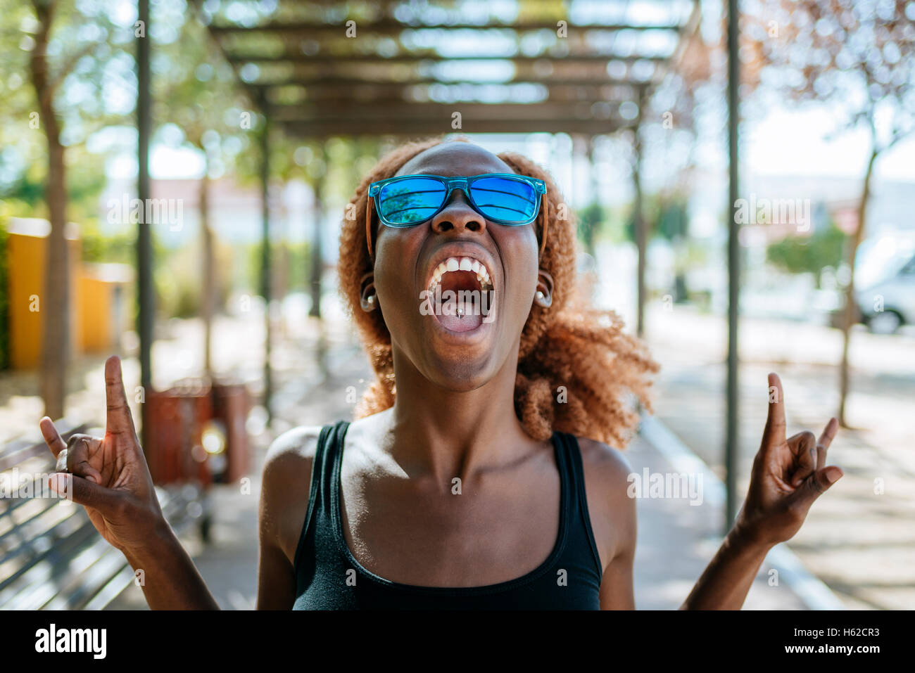 Young woman screaming outdoors Stock Photo - Alamy