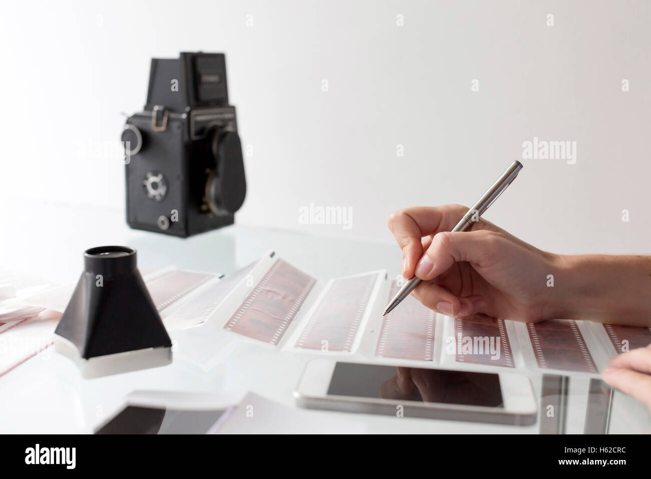Woman labeling film strips Stock Photo - Alamy
