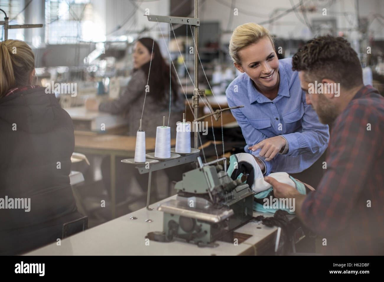 Staff working in textile factory Stock Photo - Alamy