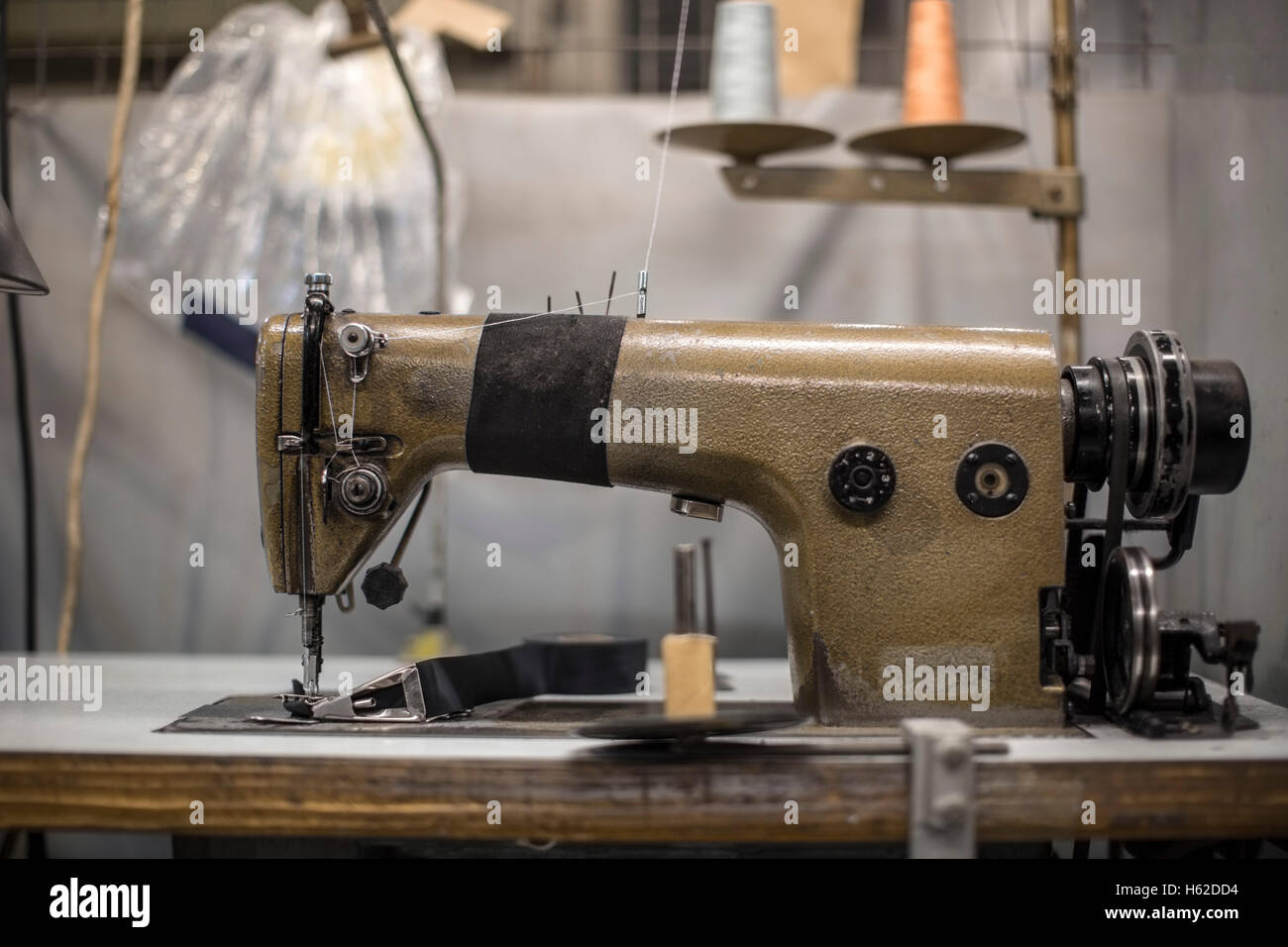 Sewing machine in tailor's workshop Stock Photo - Alamy
