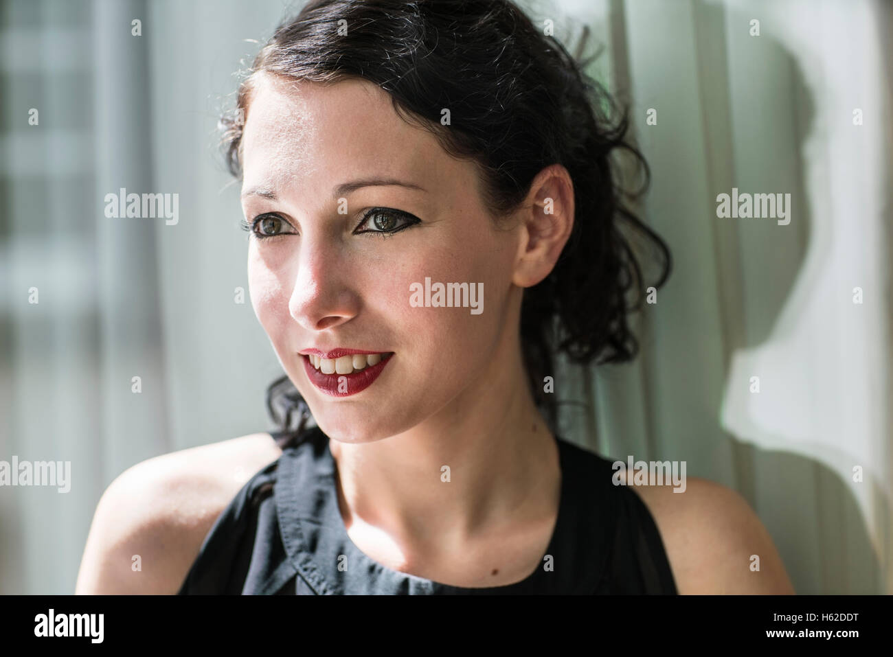 Portrait of dark-haired young woman Stock Photo - Alamy