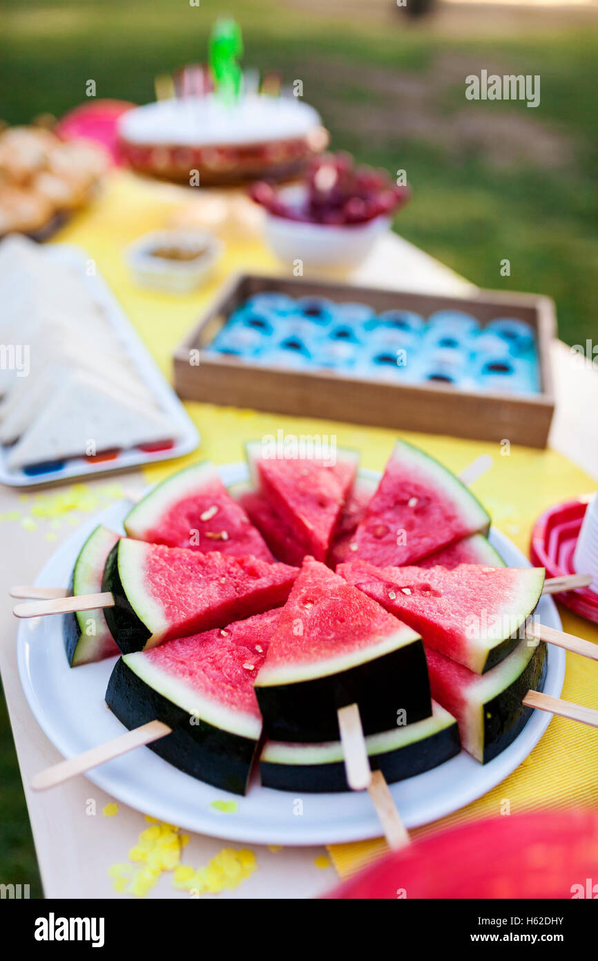 Birthday table with watermelon lollipops Stock Photo - Alamy