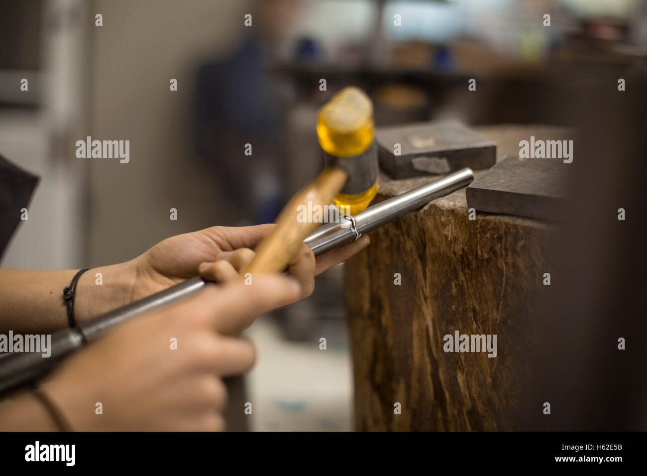 Goldsmith working with blow torch Stock Photo - Alamy