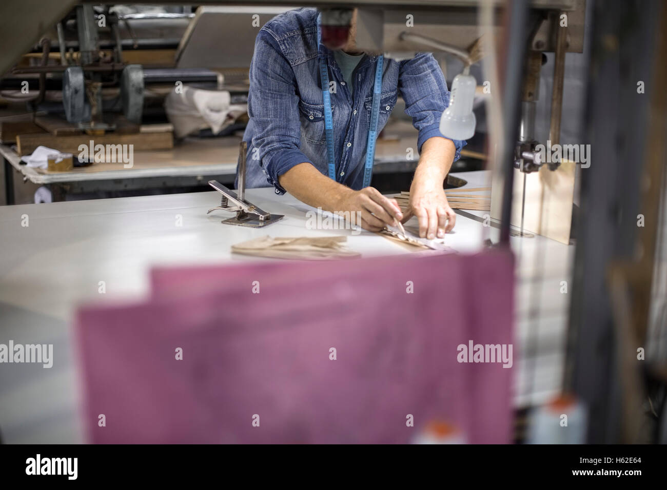 Fashion designer preparing cloth in factory Stock Photo - Alamy