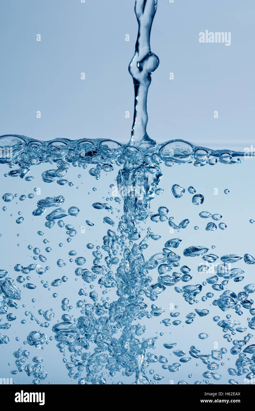 Water being poured into water Stock Photo - Alamy