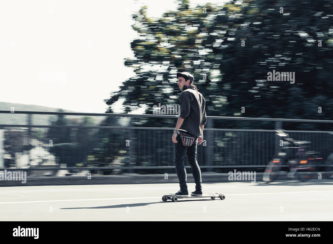 Young man skateboarding Stock Photo - Alamy