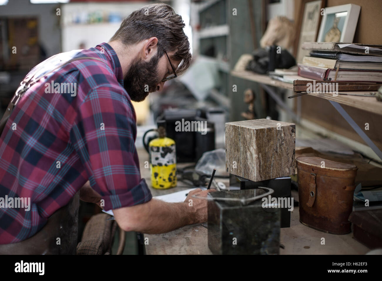 Man in workshop drawing Stock Photo - Alamy