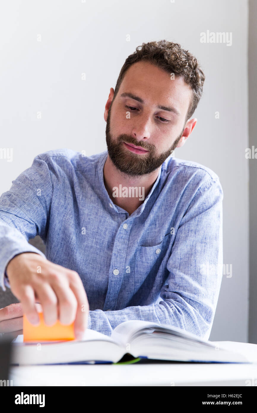 Reading young man hi-res stock photography and images - Alamy