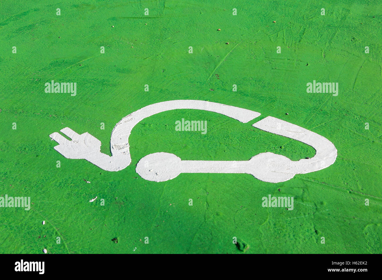 green sign for electric vehicle parking in the ground Stock Photo - Alamy