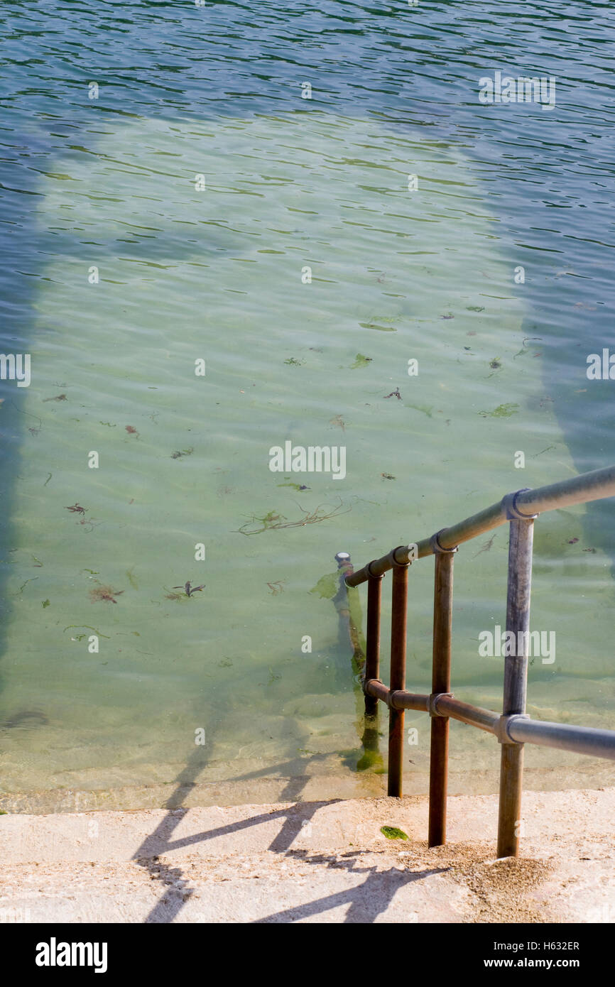 stone steps leading onto a underwater platform into the ocean Stock ...