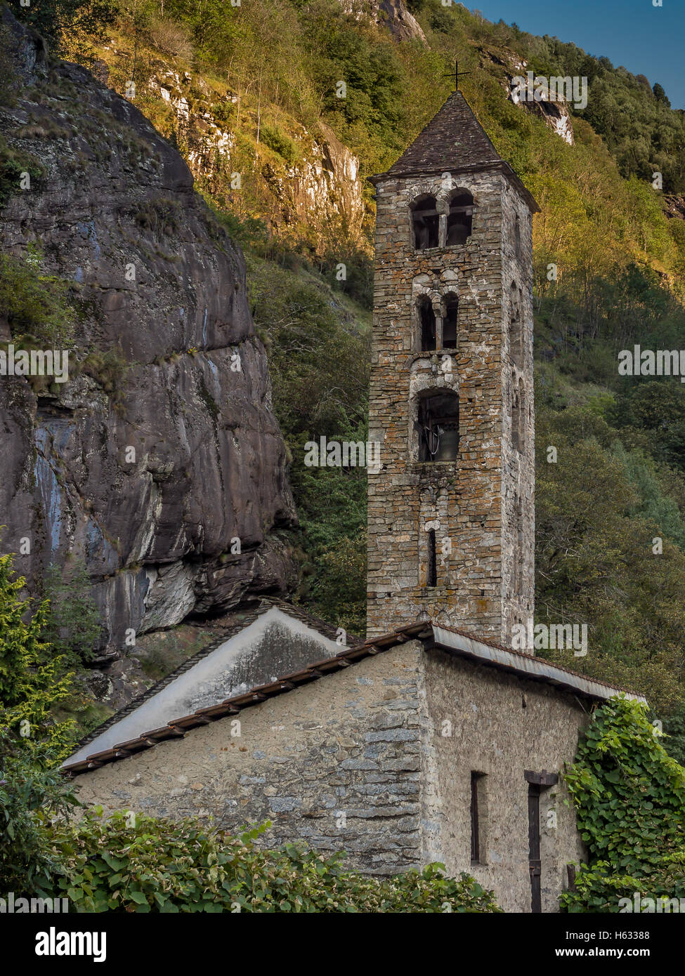 Secluded stone church in the Italian Canton of the Swiss Alps Stock ...