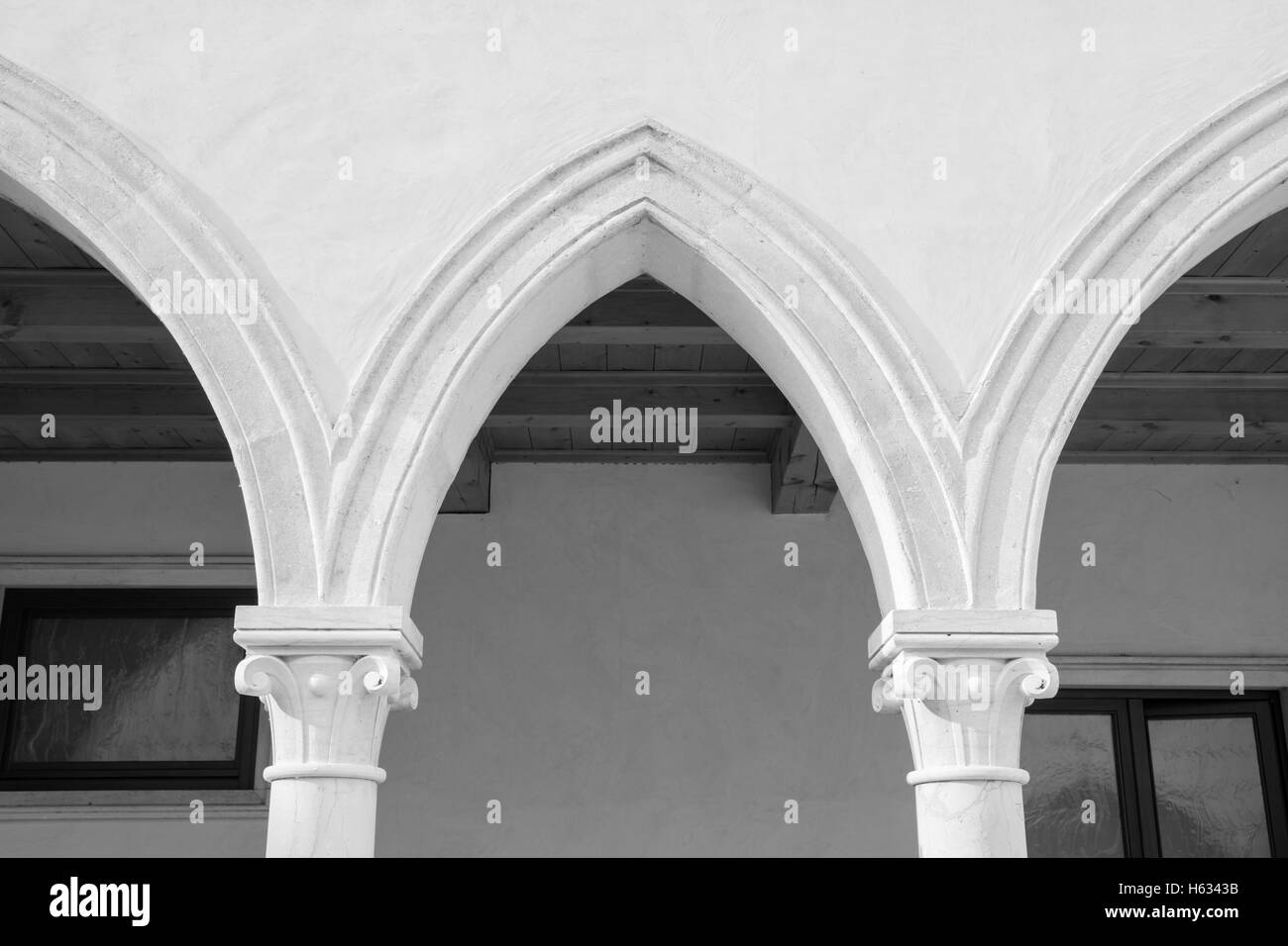 Detail of rectangular cloister with Gothic arches and marble columns ...