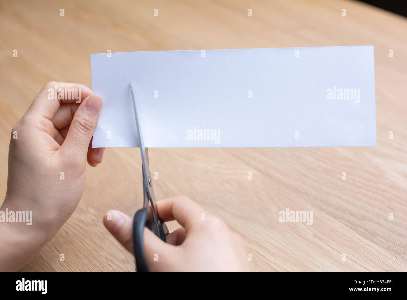 Cutting of paper hi-res stock photography and images - Alamy