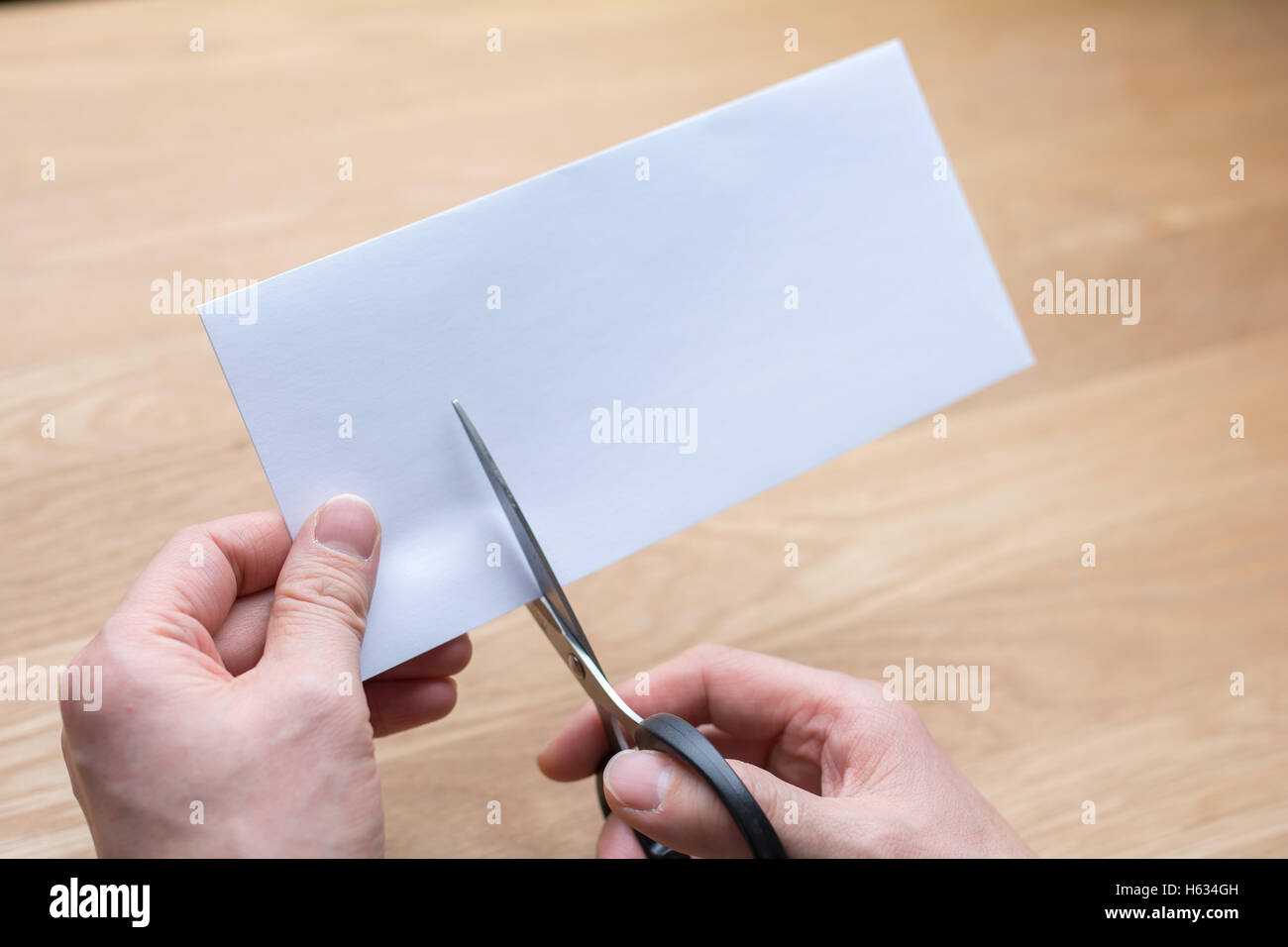 businessman cutting paper by scissors Stock Photo - Alamy