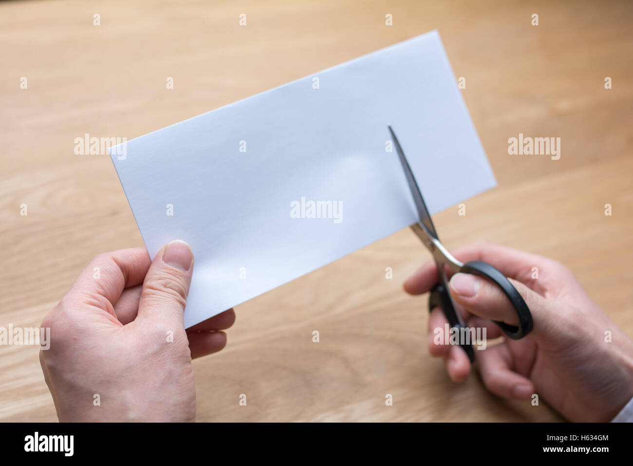Cutting paper scissors hi-res stock photography and images - Alamy