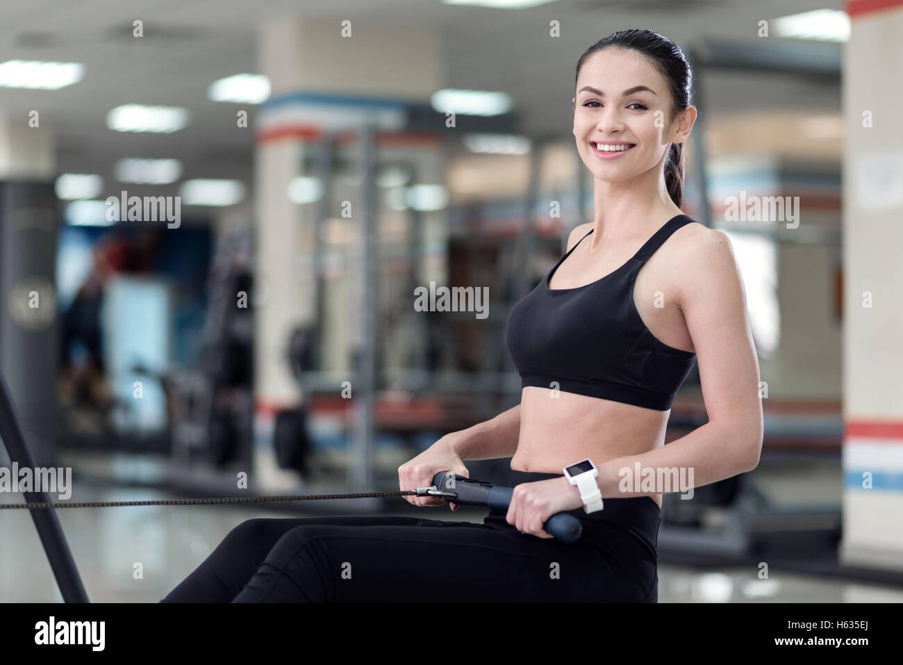 Smiling girl having a workout Stock Photo - Alamy