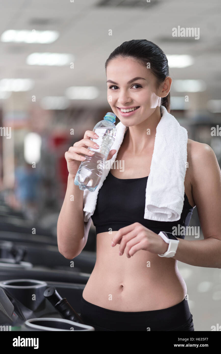 Woman drinking water after training hi-res stock photography and images - Alamy