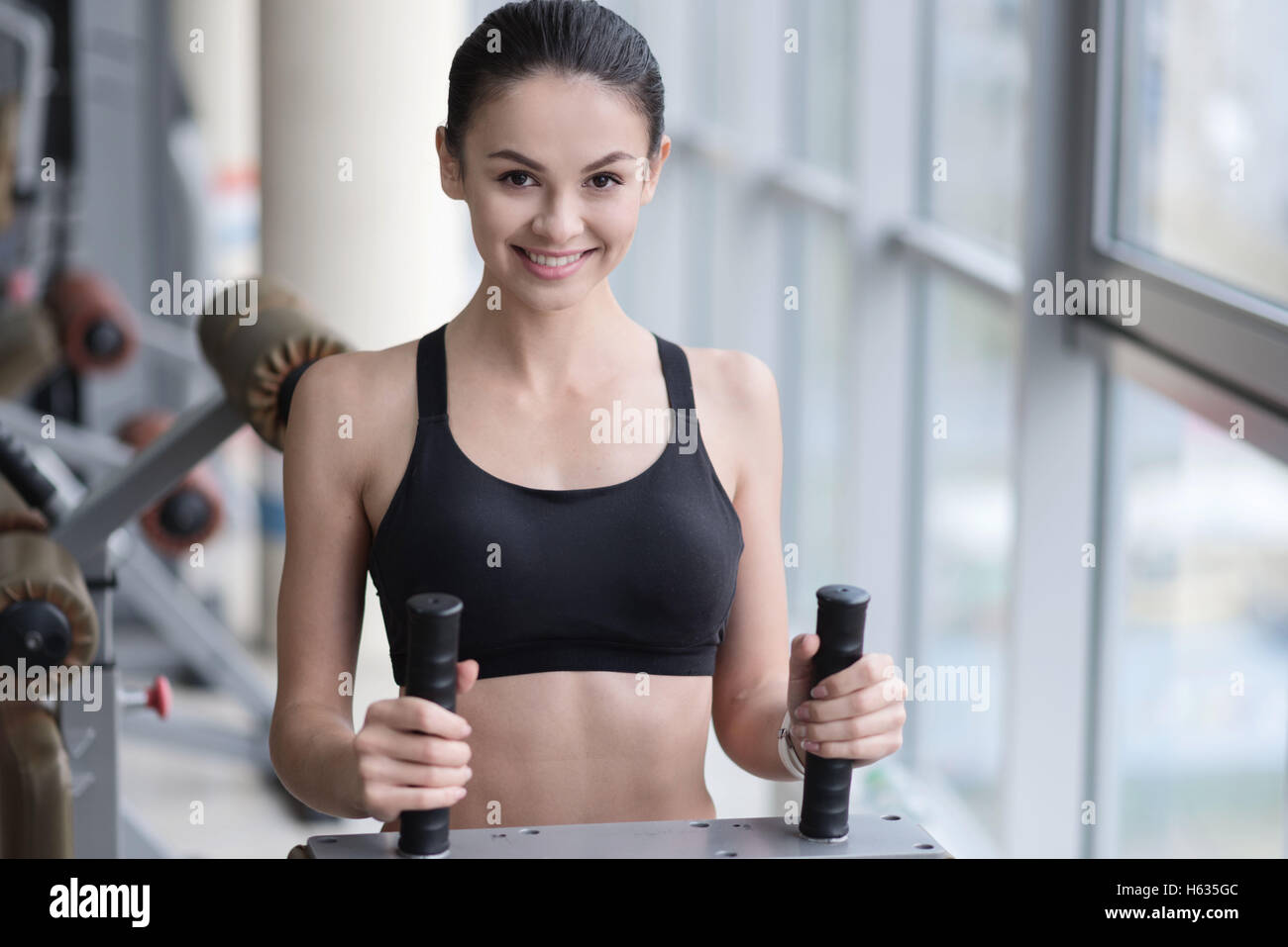 Joyful girl spending time in a gym Stock Photo - Alamy