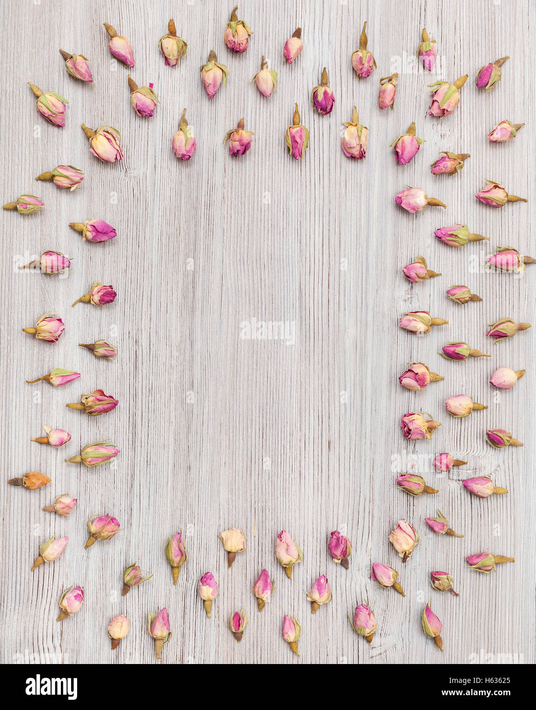 frame from many natural pink rose flower buds on wooden board Stock ...