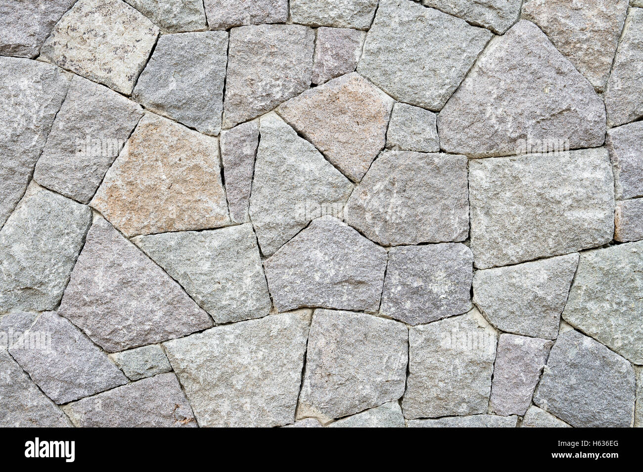 Textured gray stone packed in a tight angular pattern for a full frame ...