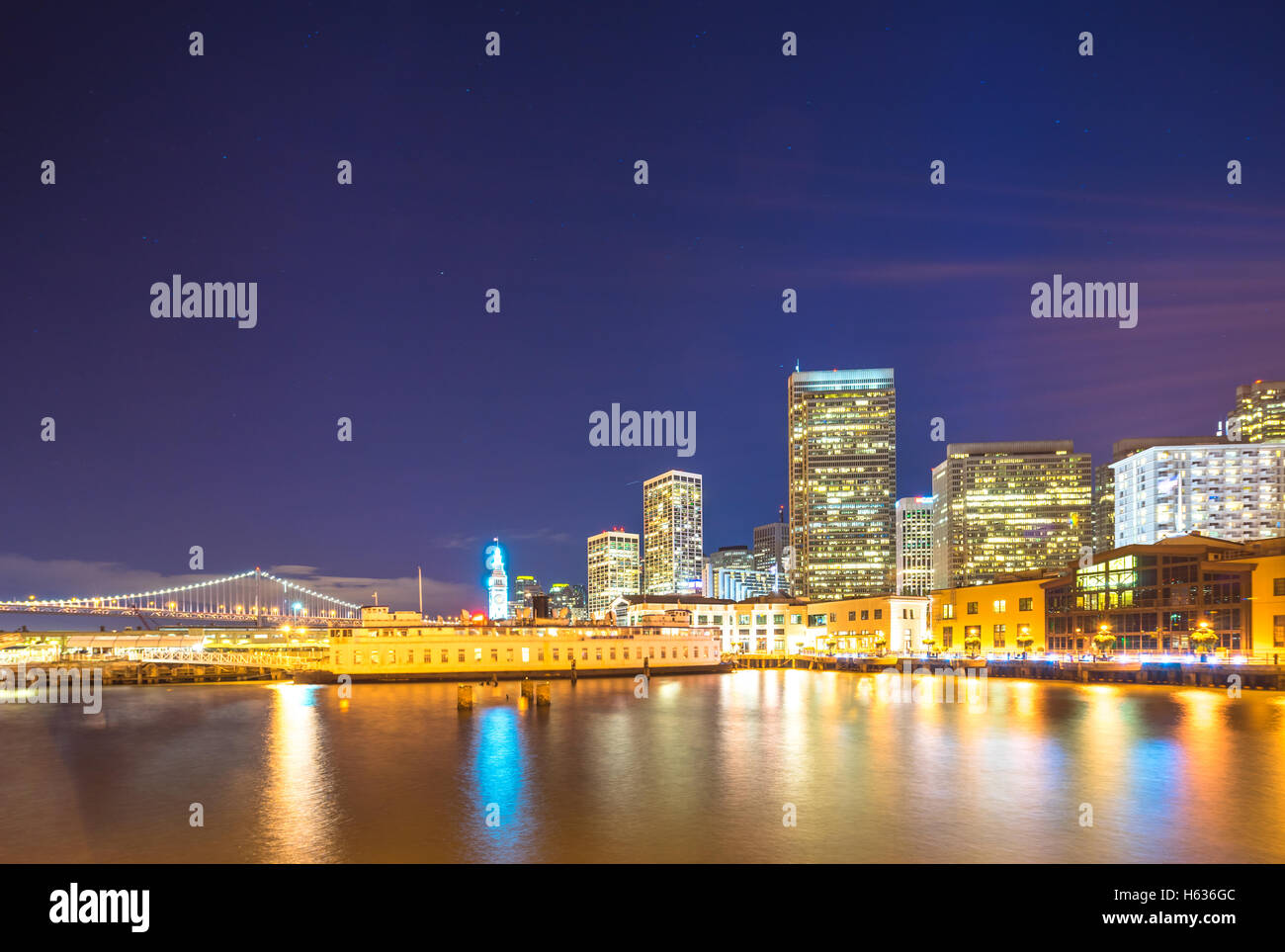 modern buildings near water in san francisco at night Stock Photo - Alamy
