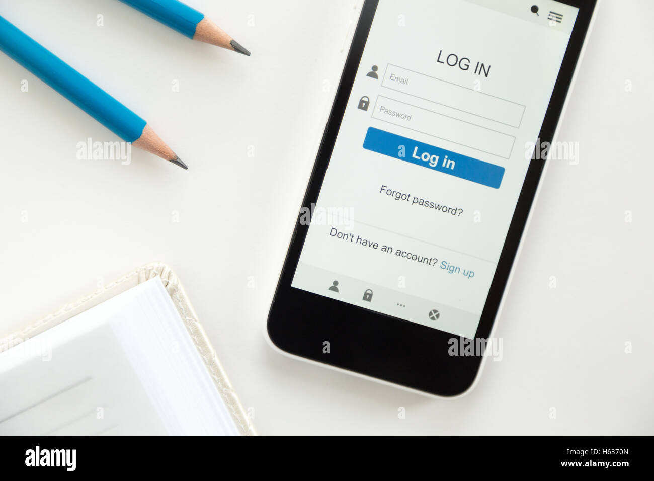 Top view of a phone on desk, log in on screen Stock Photo - Alamy