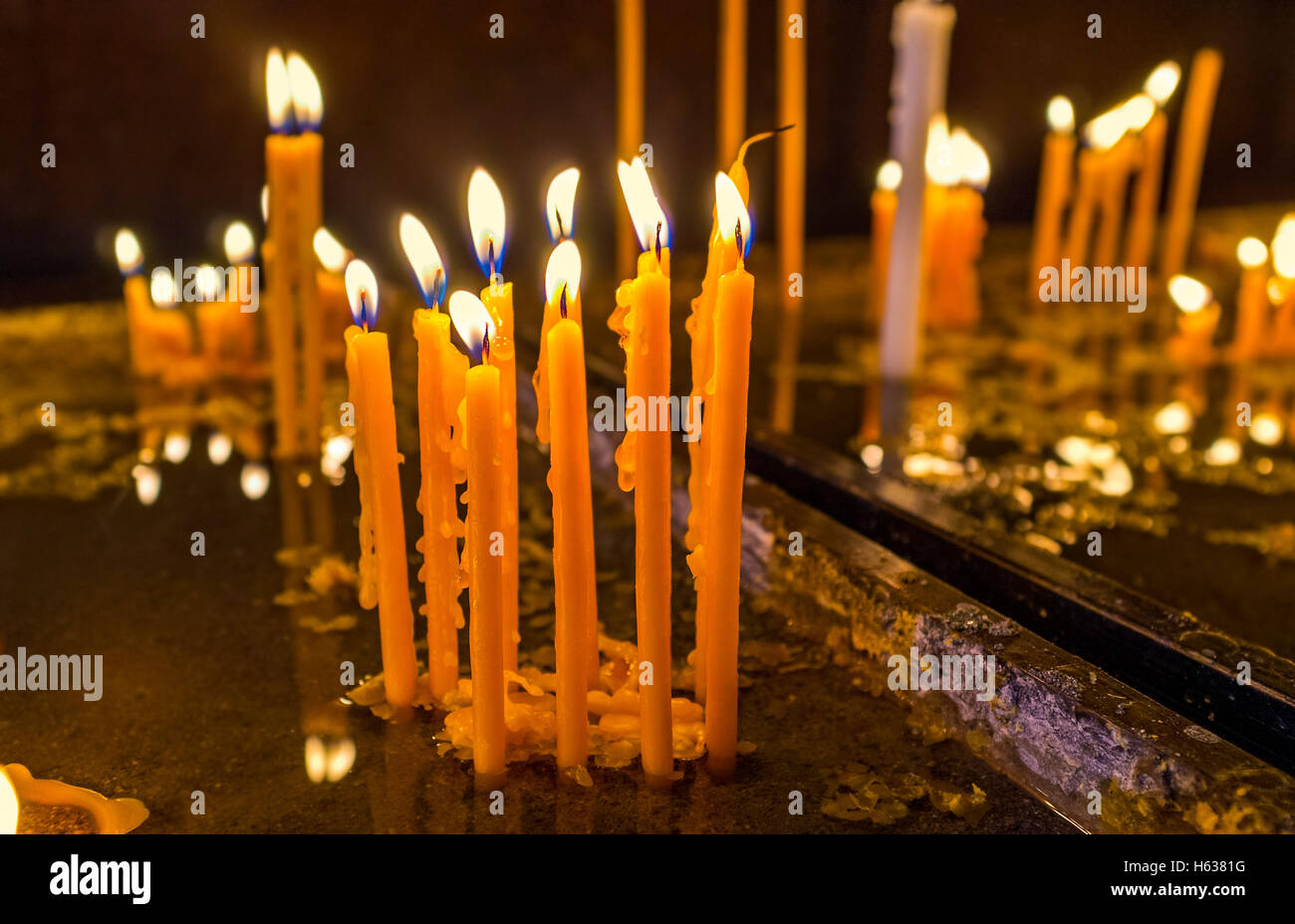 To light the candles during the prayer is the old Christian tradition ...
