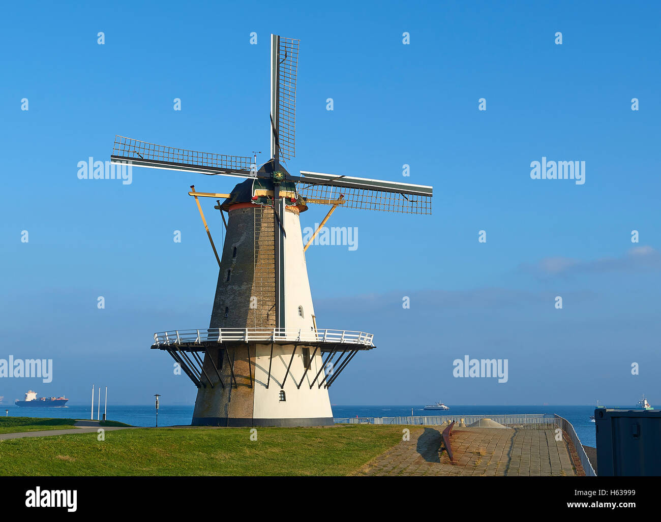 Traditional dutch windmill at the coast Stock Photo - Alamy