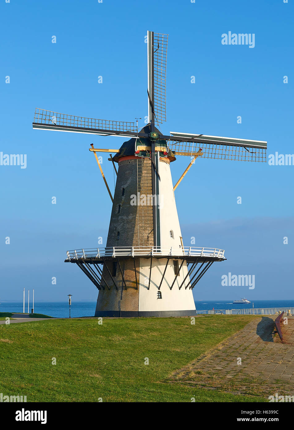 Traditional dutch windmill at the coast Stock Photo - Alamy