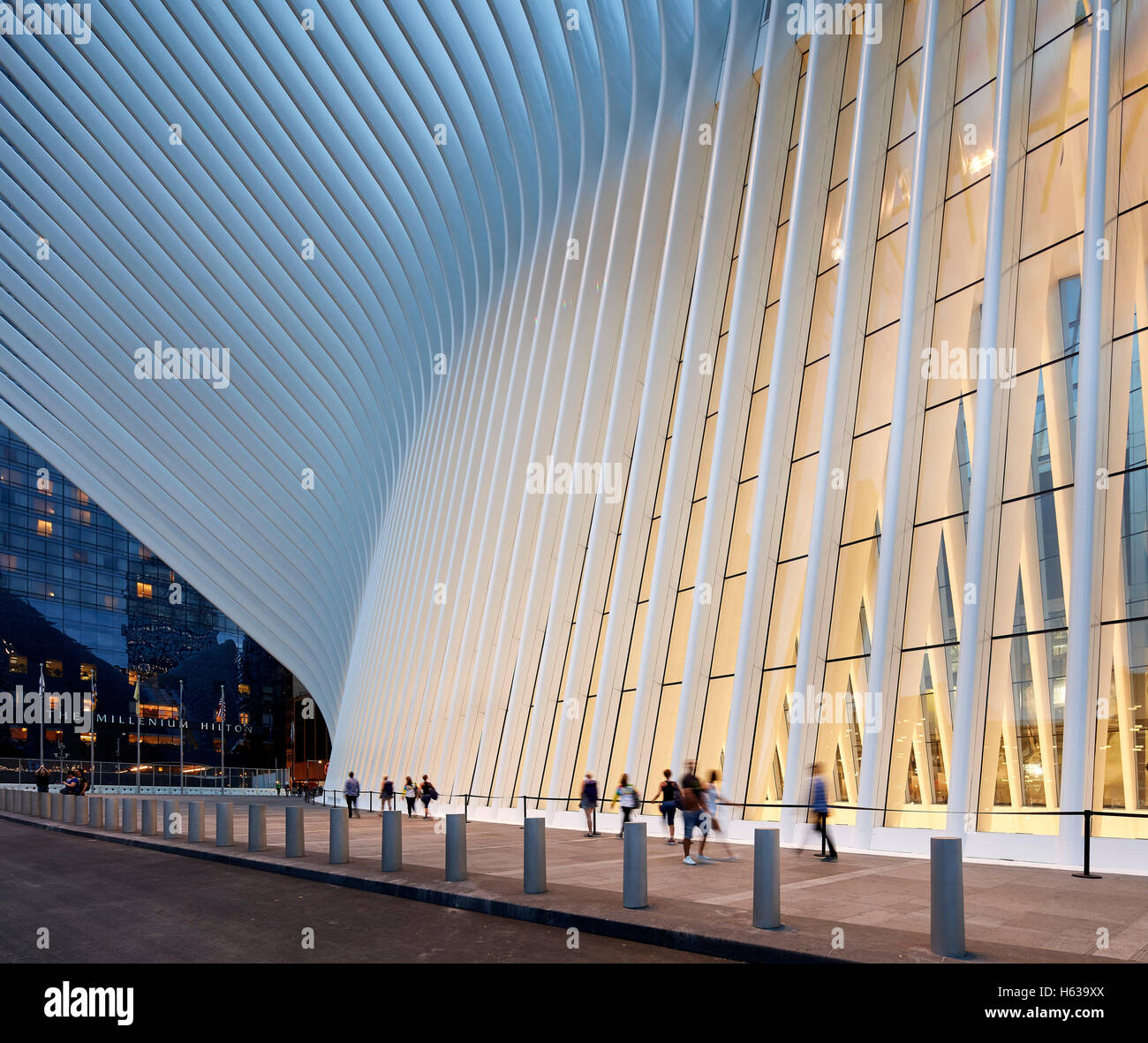 Perspective along steel rib facade at dusk. The Oculus, World Trade ...
