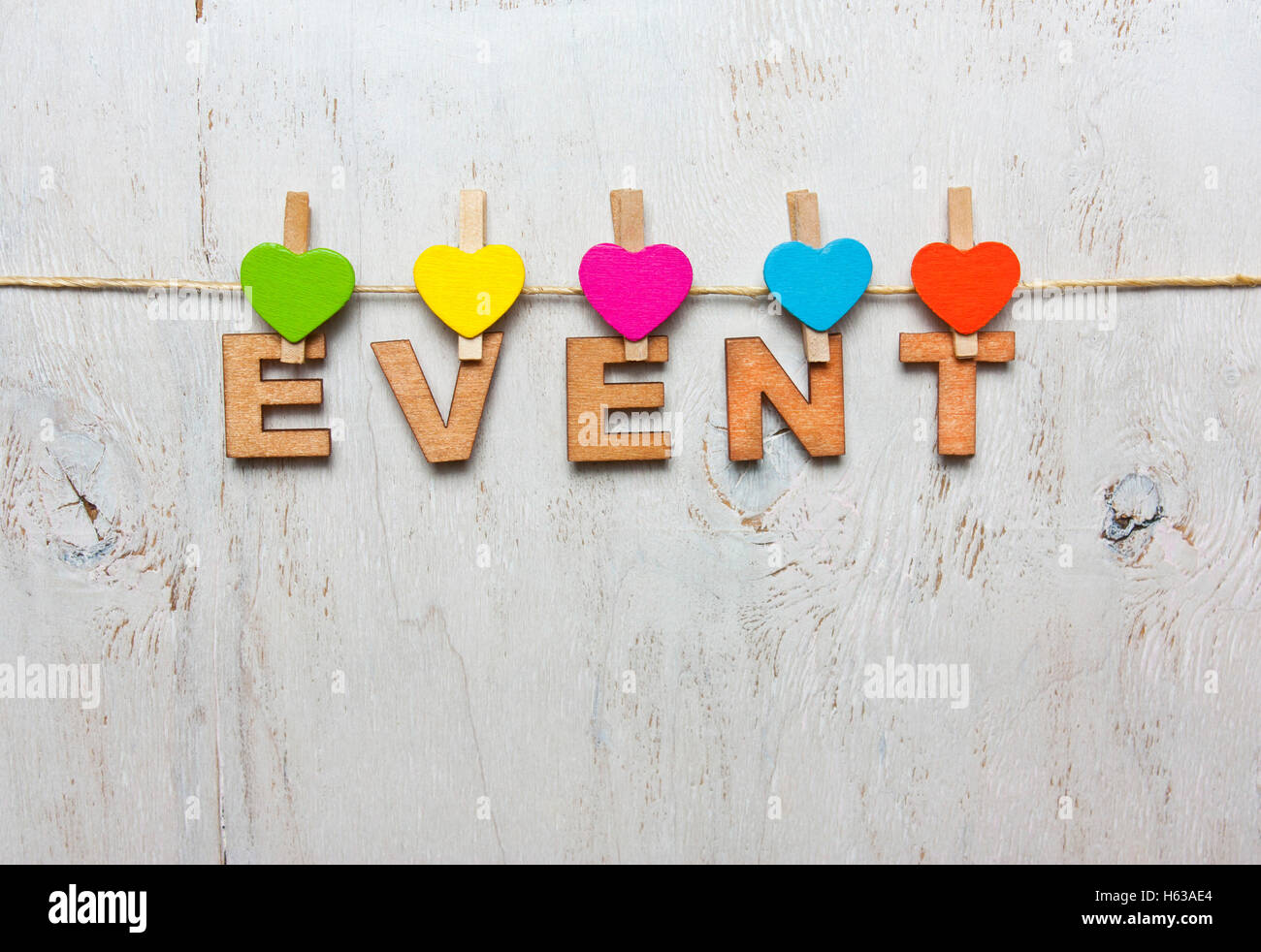 Word event of wooden letters on a white background with wooden ...