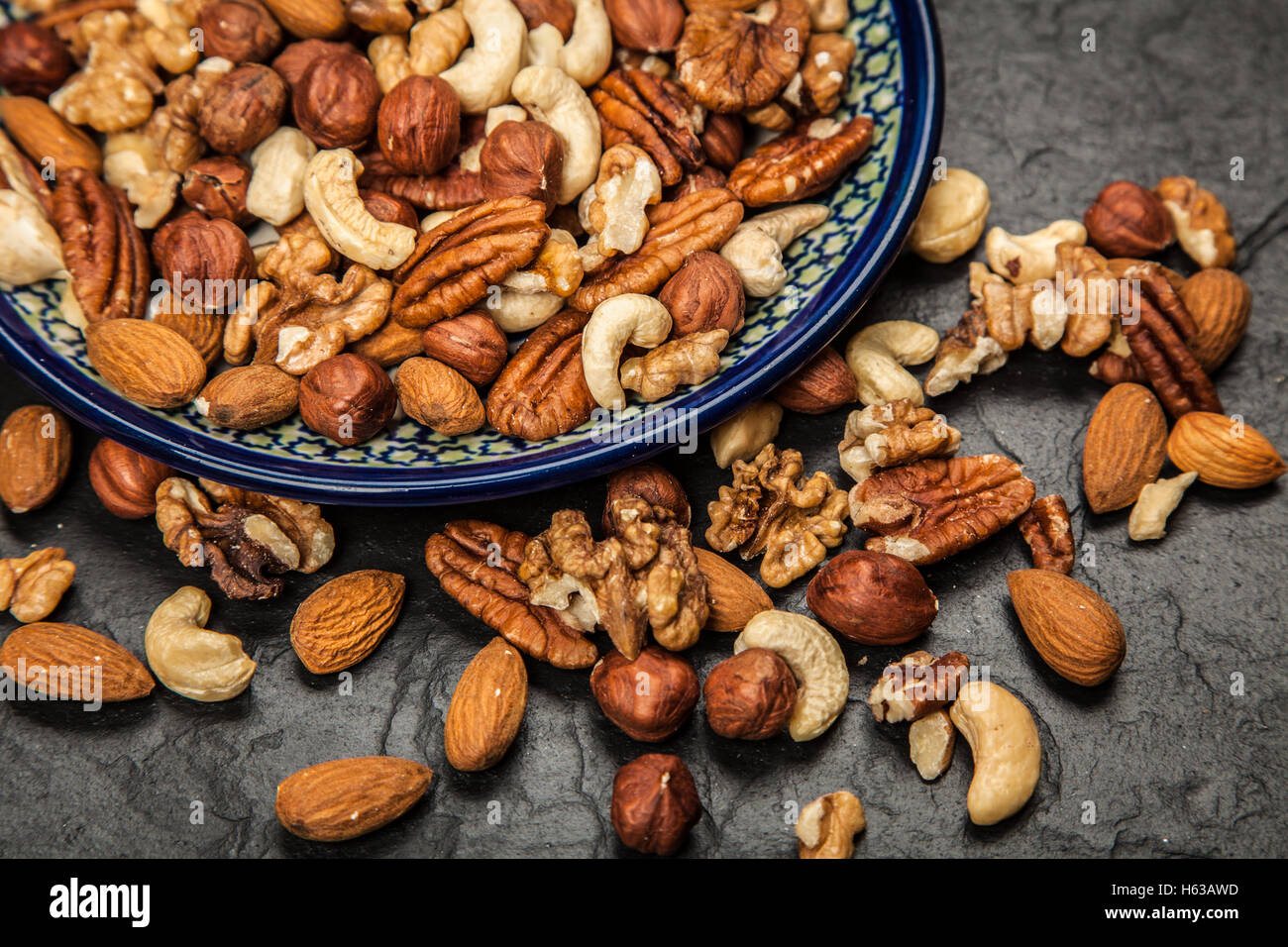 Mix of different nuts closeup photo Stock Photo - Alamy