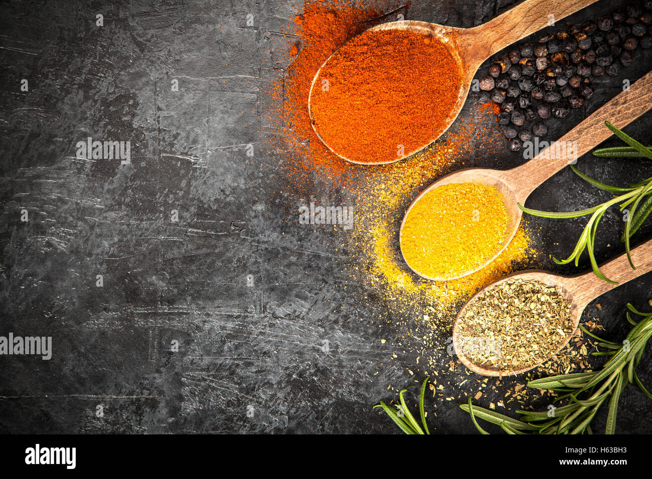 Spice on dark background Stock Photo - Alamy