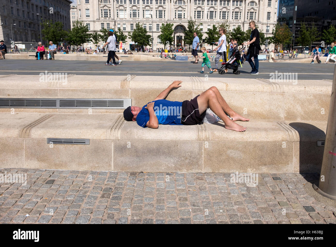 Sunbathing in City hot summer Stock Photo - Alamy