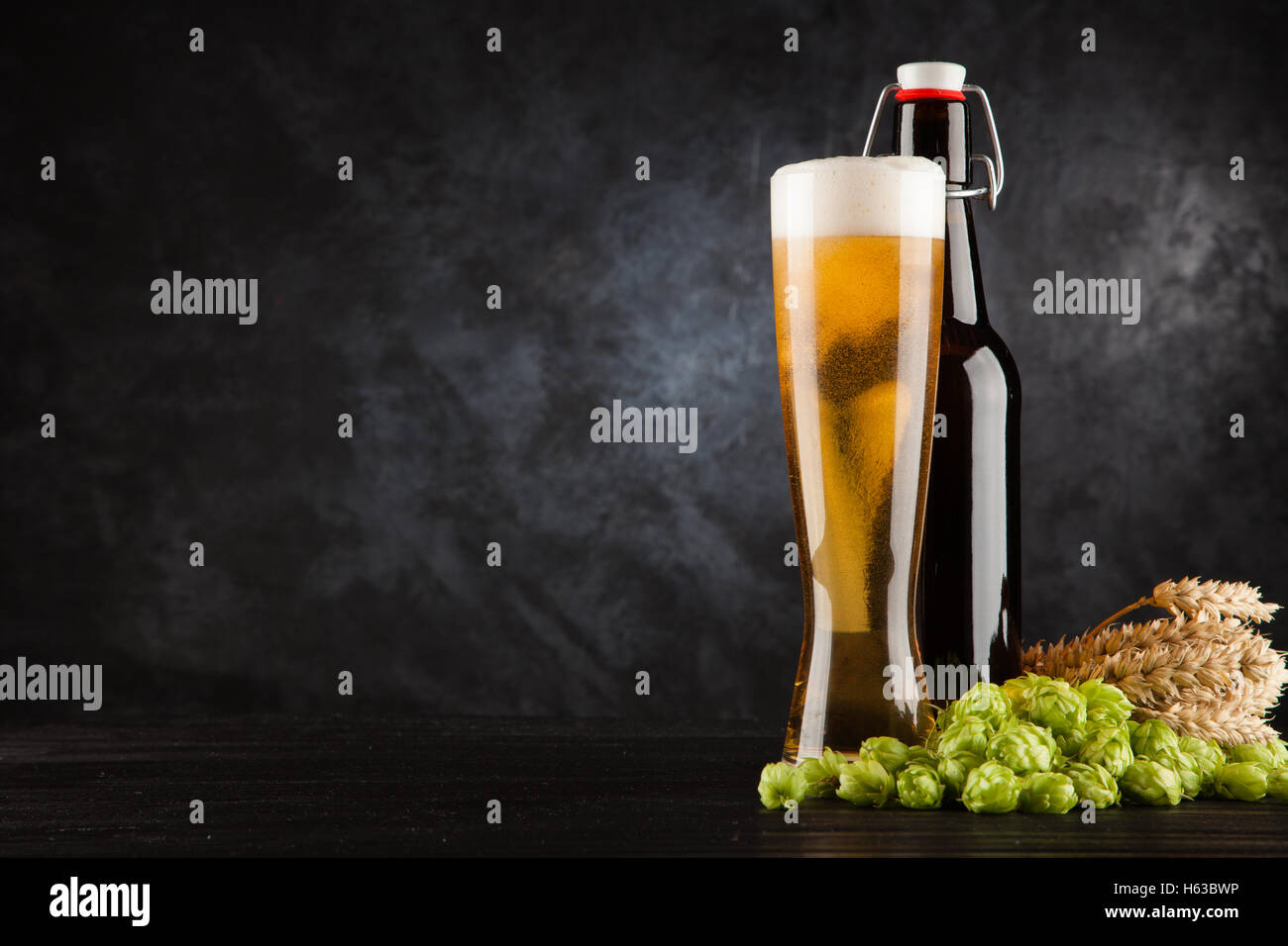 Beer glass on dark background Stock Photo - Alamy