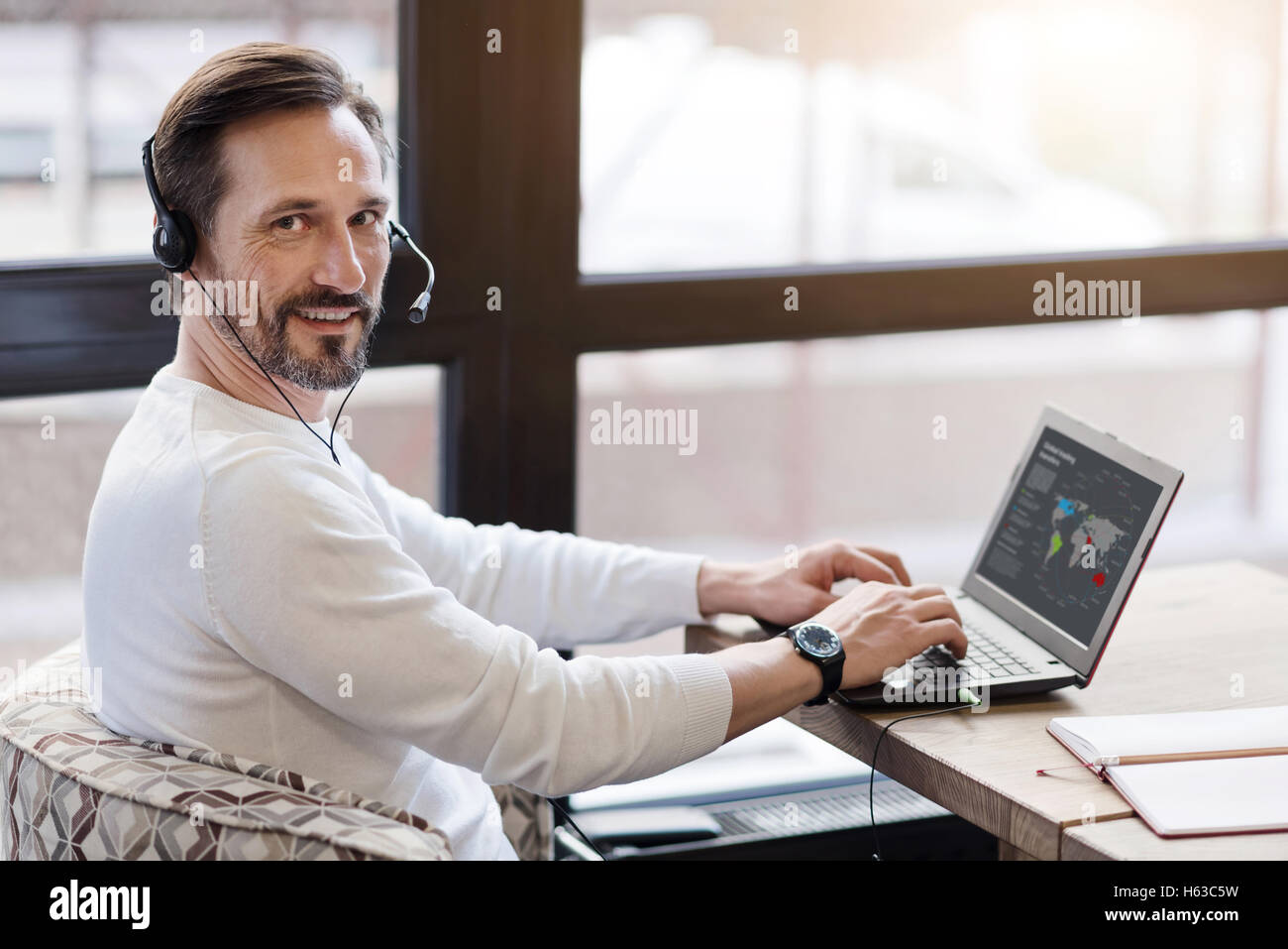 Side view of an using laptop Stock Photo - Alamy