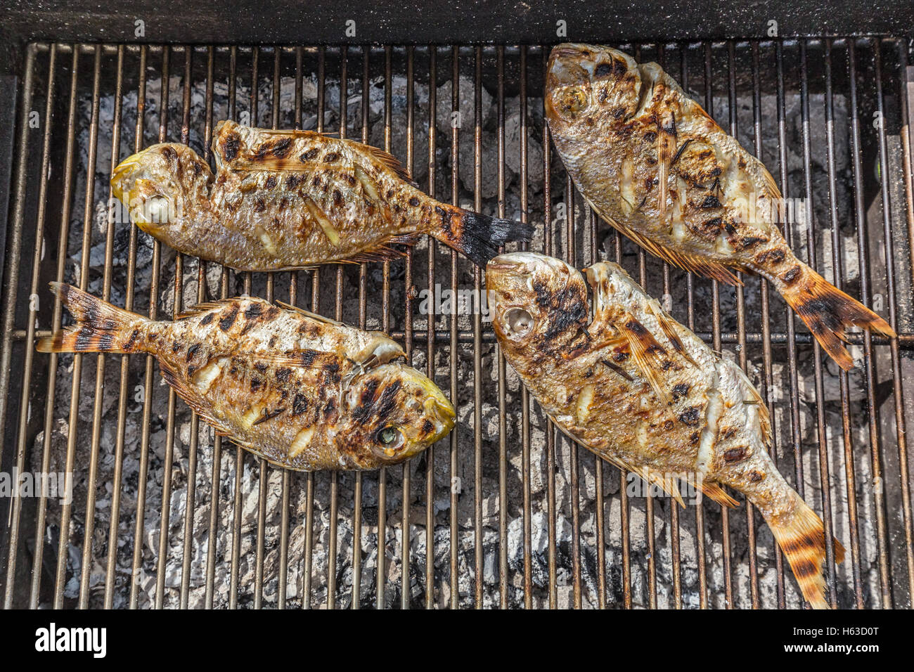 Fish Fried On The Grill Outdoor Stock Photo - Alamy