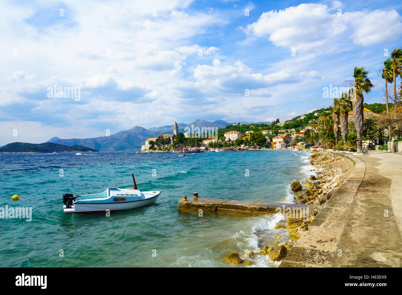 View of the fishing port and the beach, with cafes, boats, in the ...