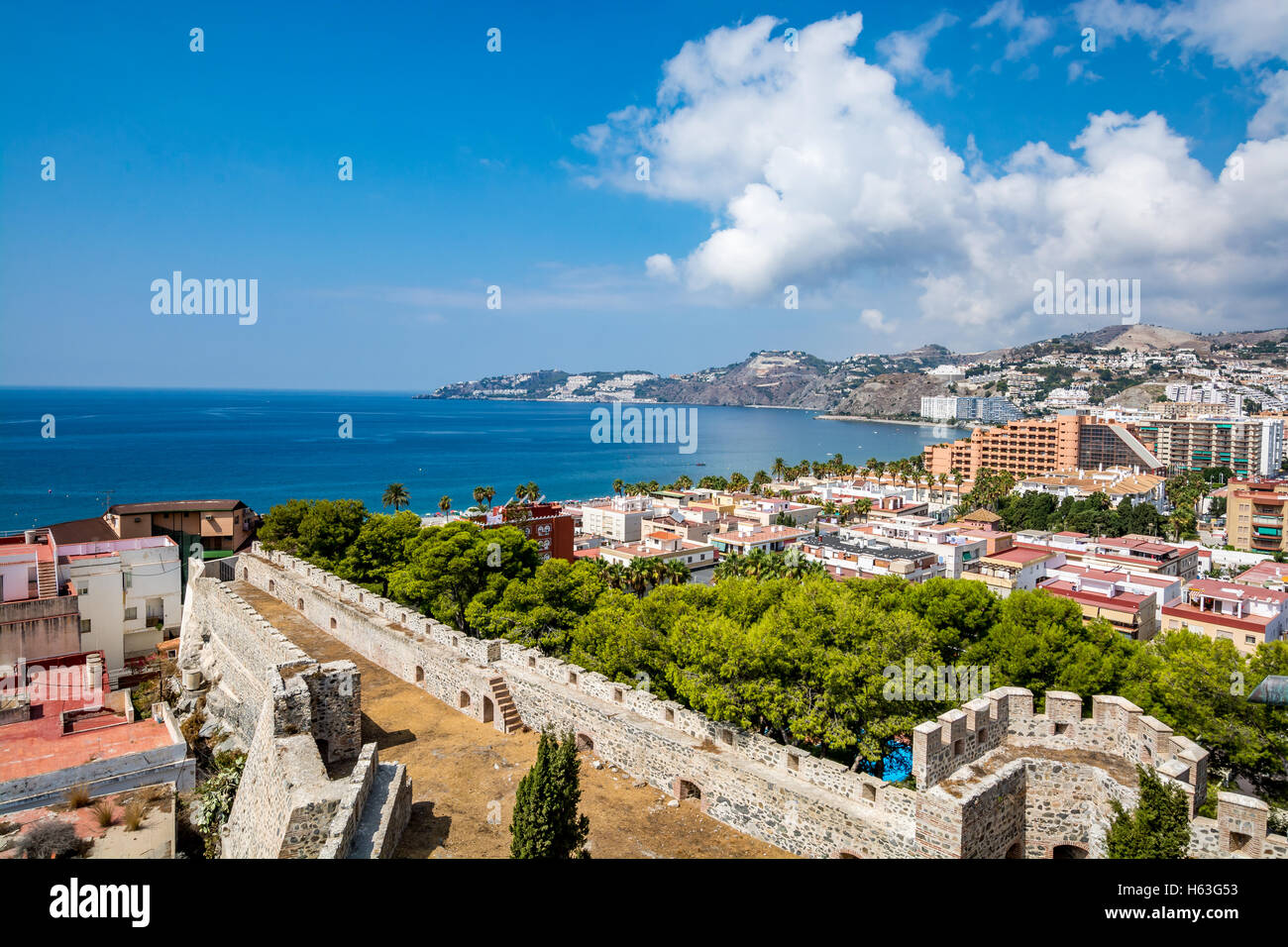 Panoramic view of Almuñécar (Almunecar) with castle walls on a ...