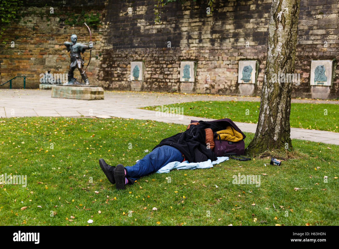 A homeless man sleeping rough near the Robin Hood statue. In Nottingham ...