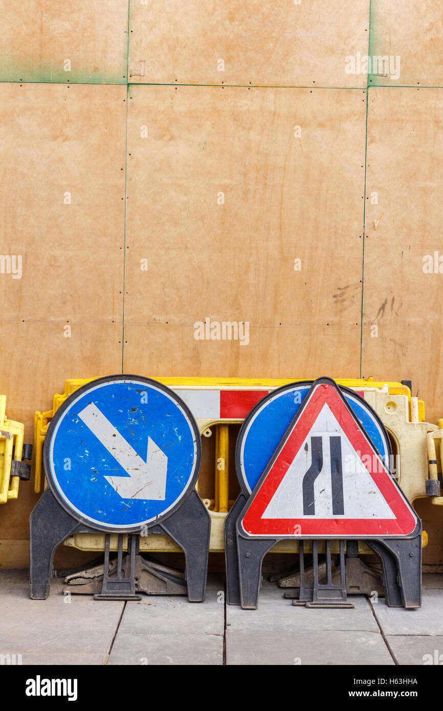 Piles of road and street signs by edge of a road. In Nottingham ...