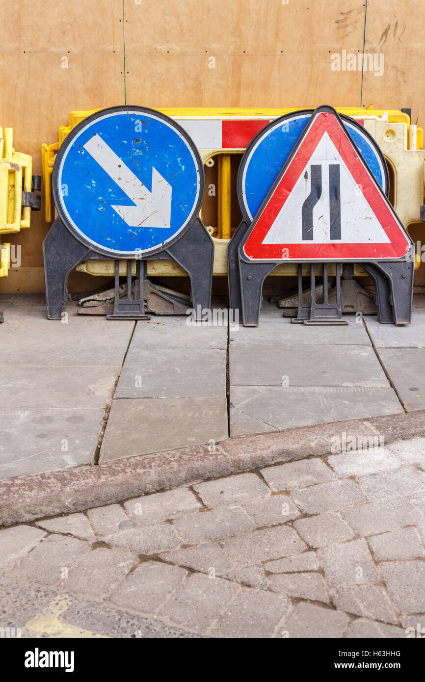 Piles of road and street signs by edge of a road. In Nottingham ...