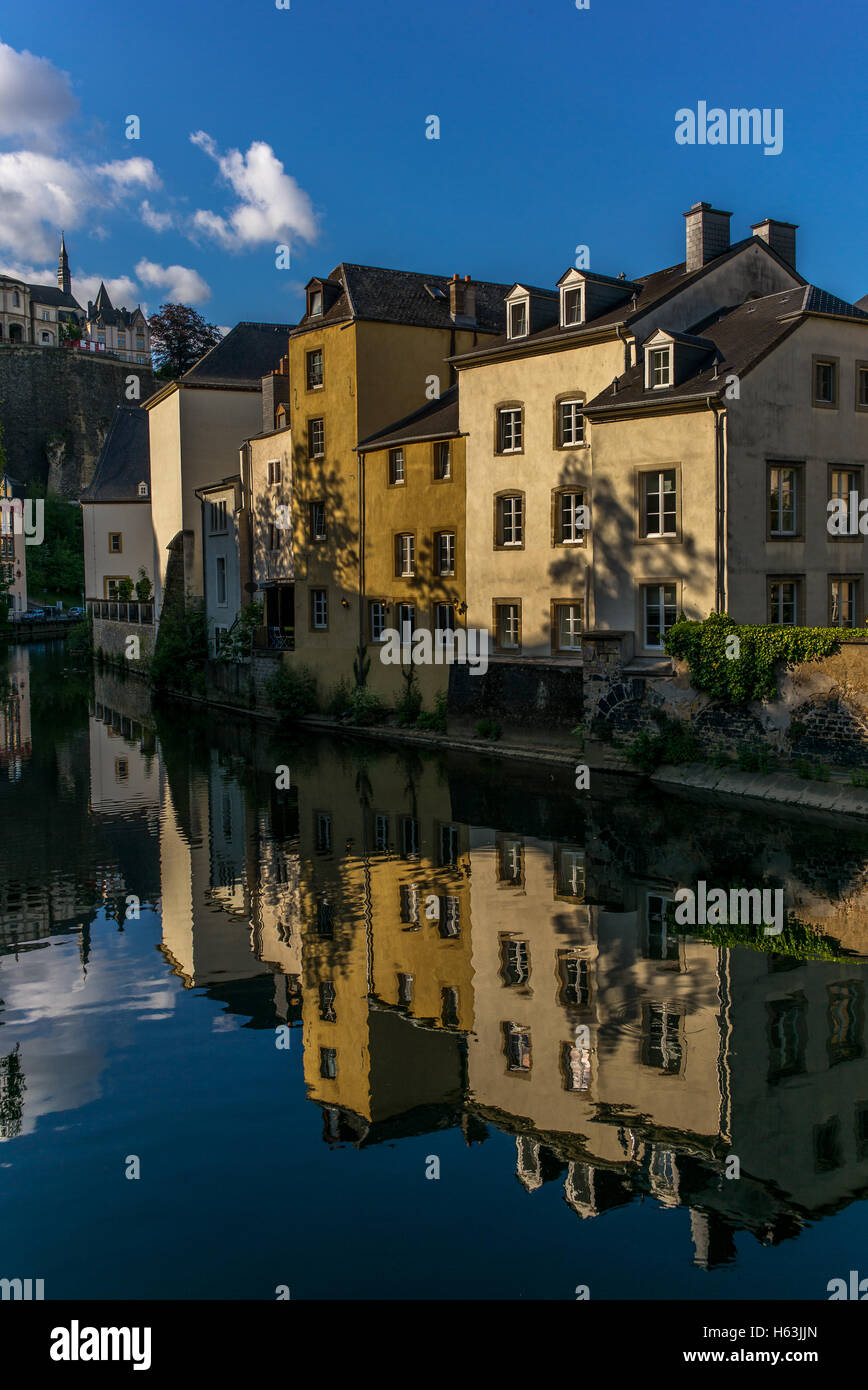 Colorful buildings reflecting in the Alzette river in the city of ...