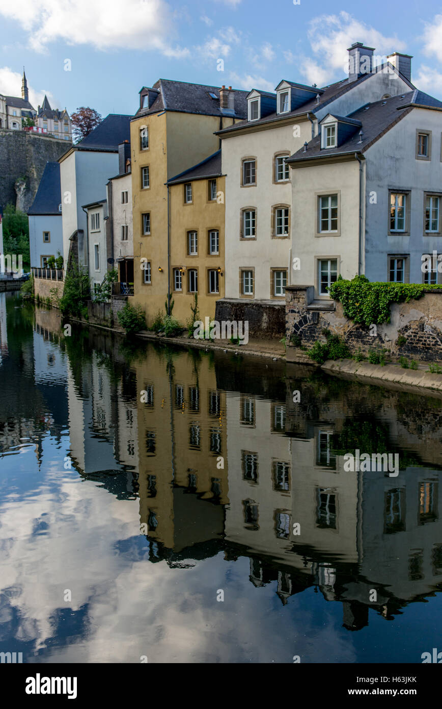 Colorful buildings reflecting in the Alzette river in the city of ...