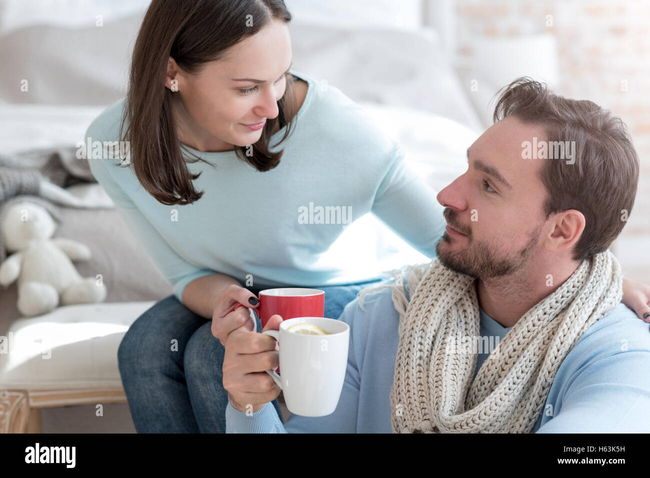 Cheerful nice couple drinking tea Stock Photo - Alamy