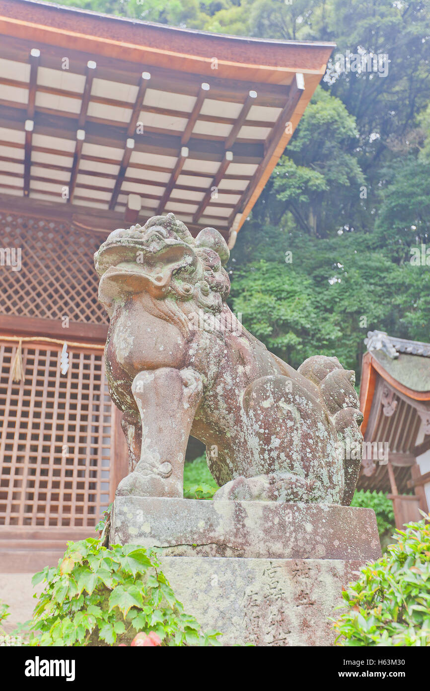 Komainu lion-dog guardian statue in Ujigami Shinto Shrine in Uji city ...