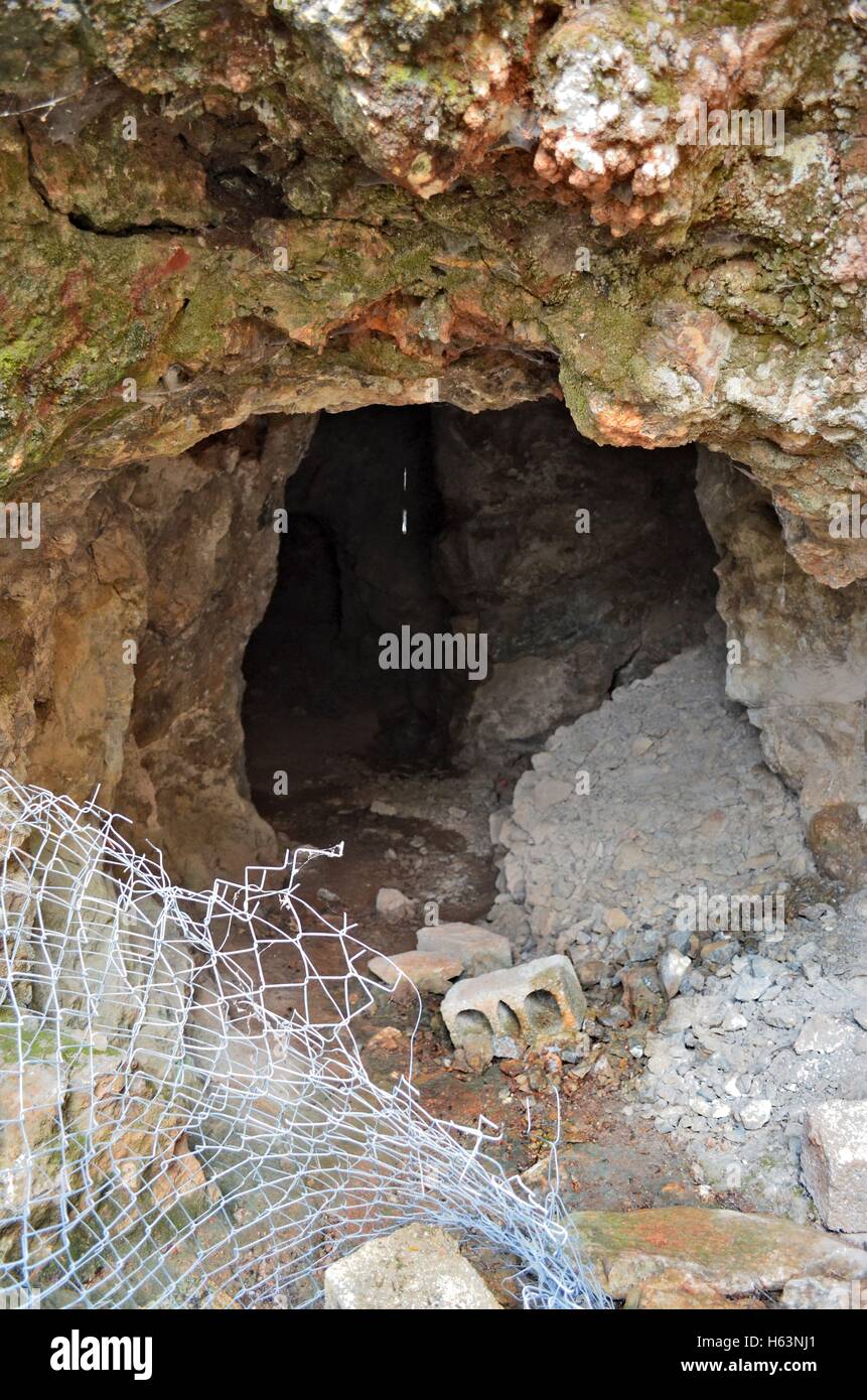 Walking inside dangerous caves and mines in Greece Stock Photo - Alamy