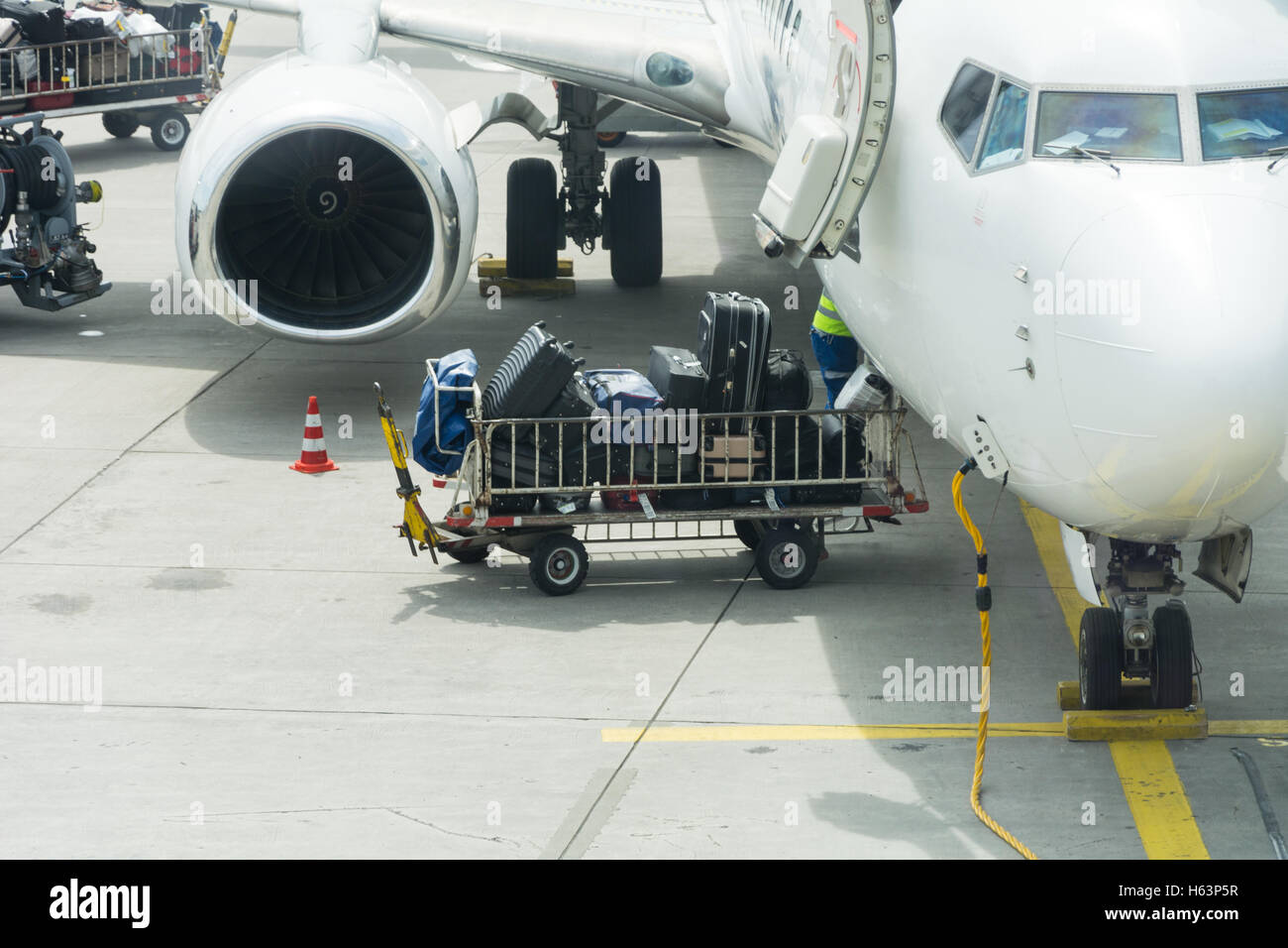 Aircraft maintenance, loading luggage on the plane to the airport Stock ...