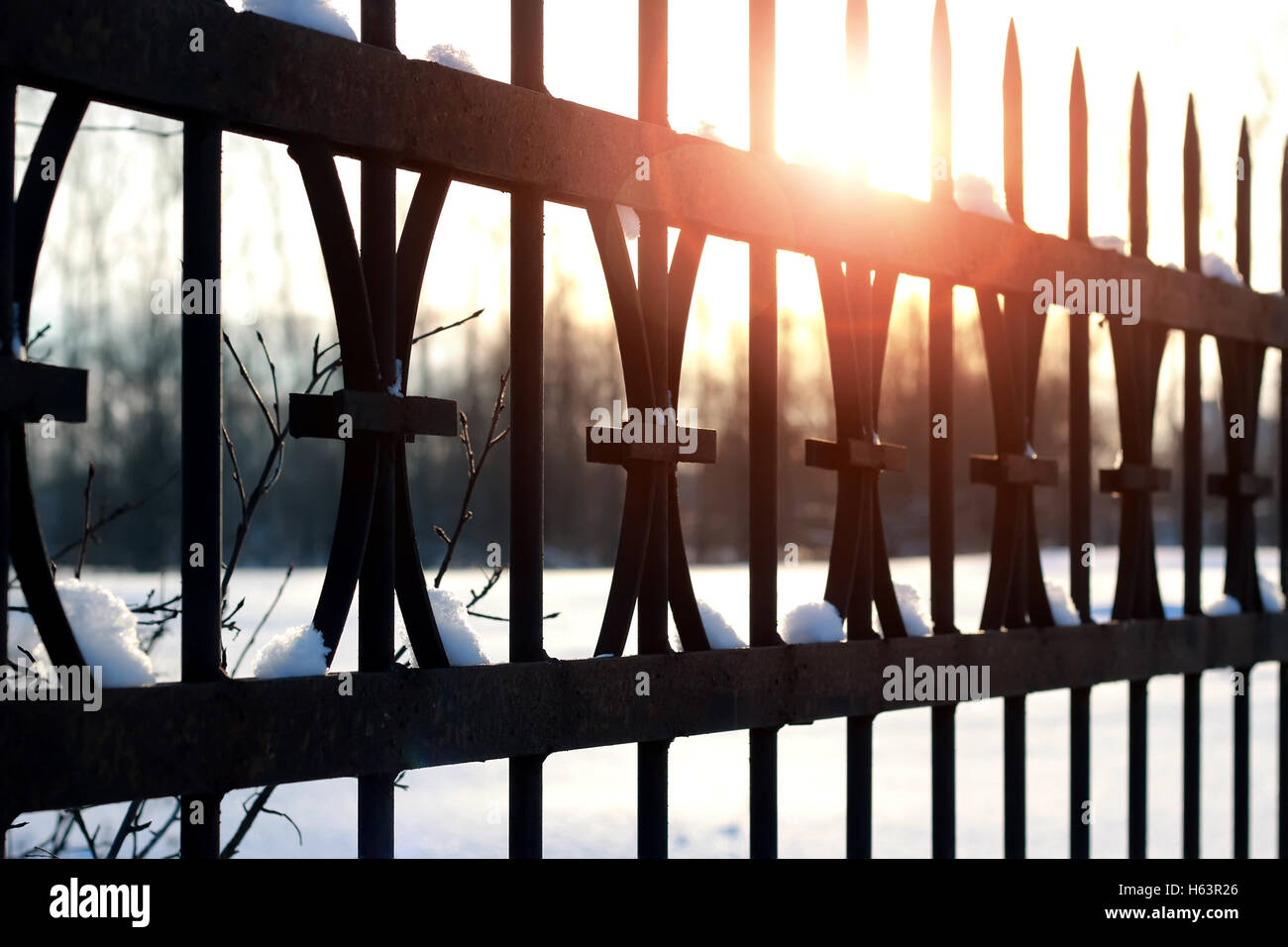 fence with spikes sun Stock Photo - Alamy